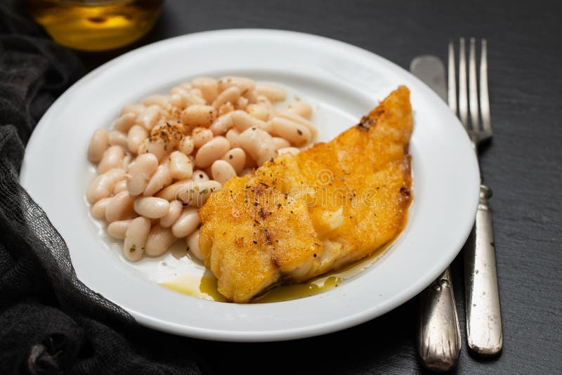 Fried Cod Fish with White Beans on the Plate. Stock Photo - Image of ...