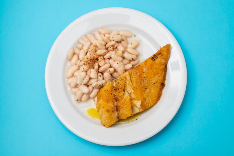 Fried Cod Fish with White Beans on the Plate Stock Image - Image of ...