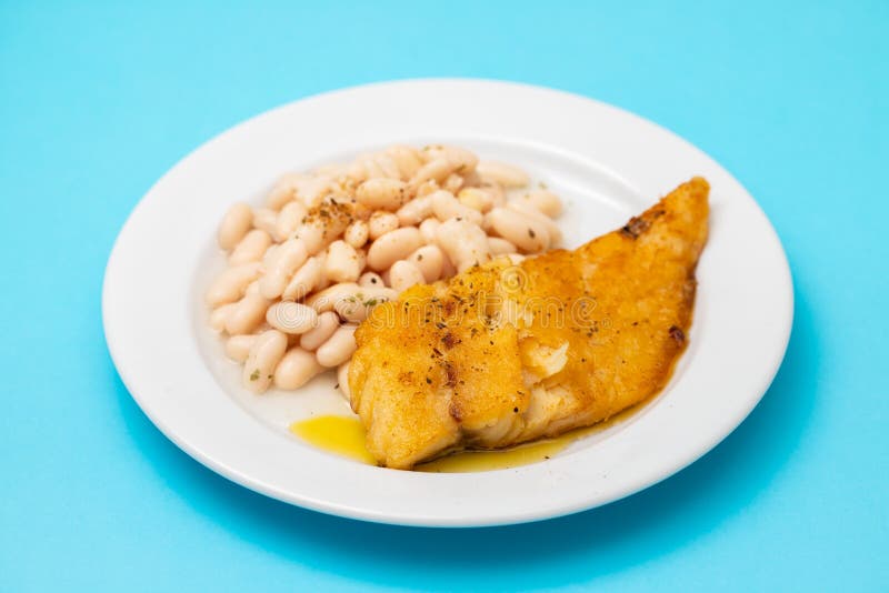 Fried Cod Fish with White Beans on the Plate Stock Image - Image of ...