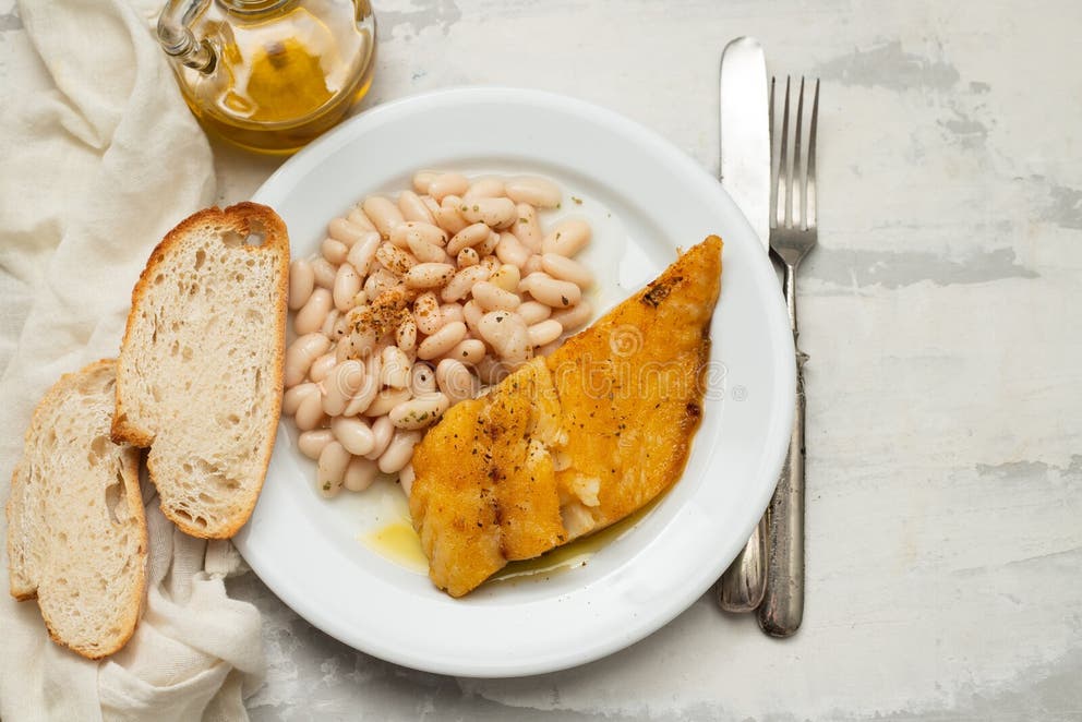 Fried Cod Fish with White Beans on the Plate. Stock Image - Image of ...