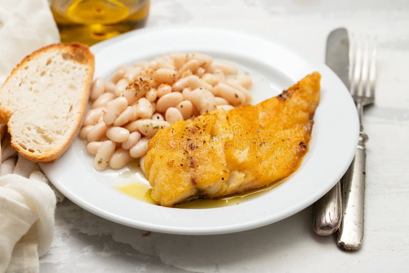Fried Cod Fish with White Beans on the Plate. Stock Image - Image of ...