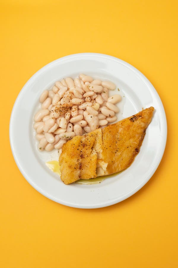 Fried Cod Fish with White Beans on the Plate. Stock Photo - Image of ...