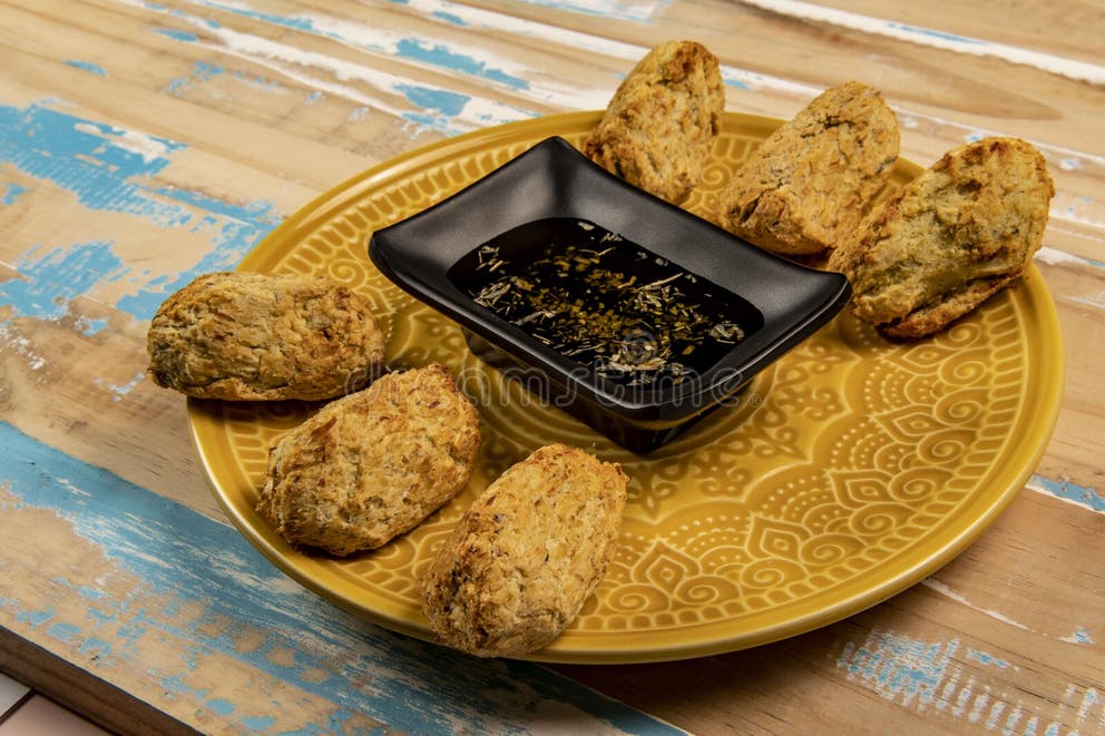 Fried Cod Fritters in Portions, with a Bowl of Olive Oil Stock Image ...