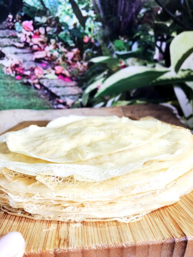 Fried Crepes on a Chopping Board on a Table. Horizontal View from Above ...