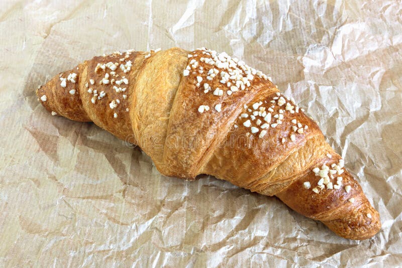 Fried croissant on paper stock image. Image of roll - 211219007