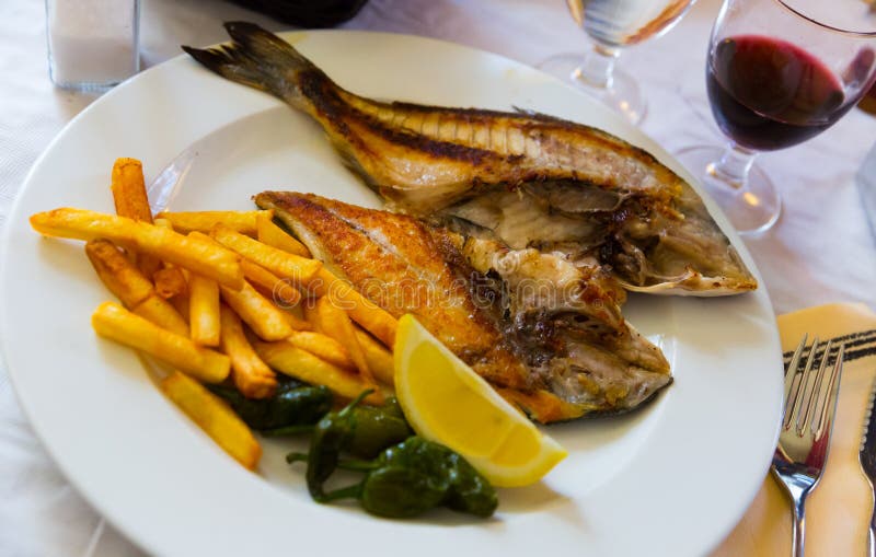 Fried cut dorada fish stock image. Image of recipe, eating - 211889105