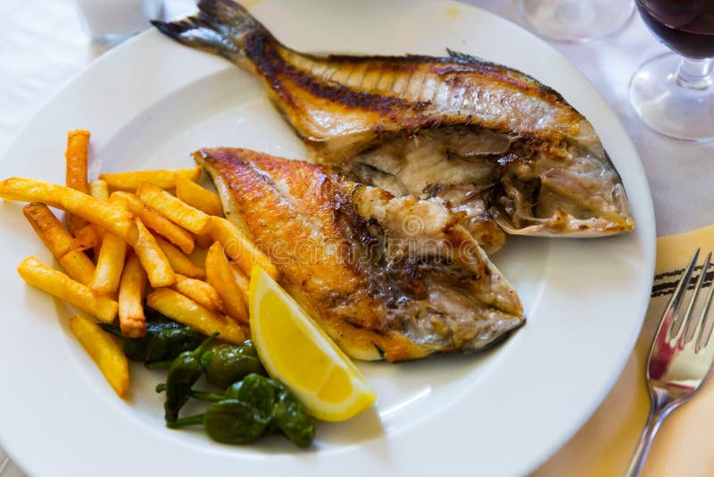 Fried cut dorada fish stock photo. Image of mediterranean - 254353652