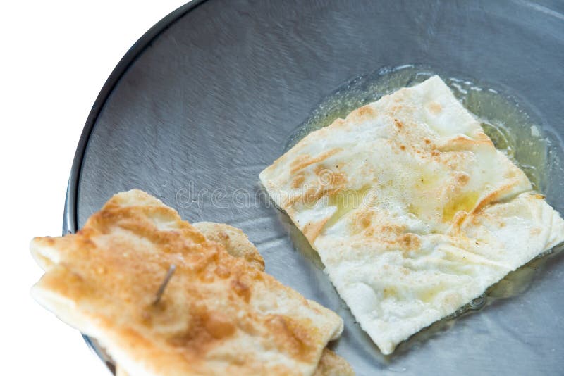 Fried Delicious Roti on a Hot Pan, White Background, Focus Selective ...