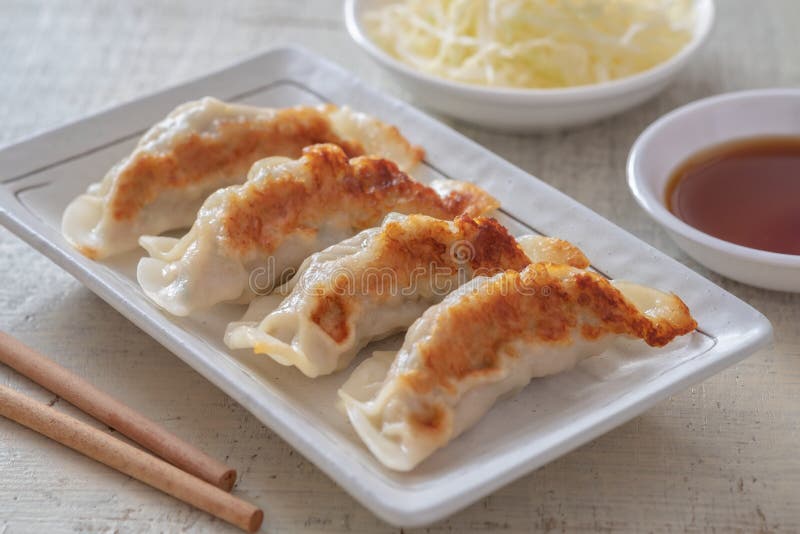 Fried Dumplings Gyoza on Plate and Soy Sauce Stock Image - Image of ...
