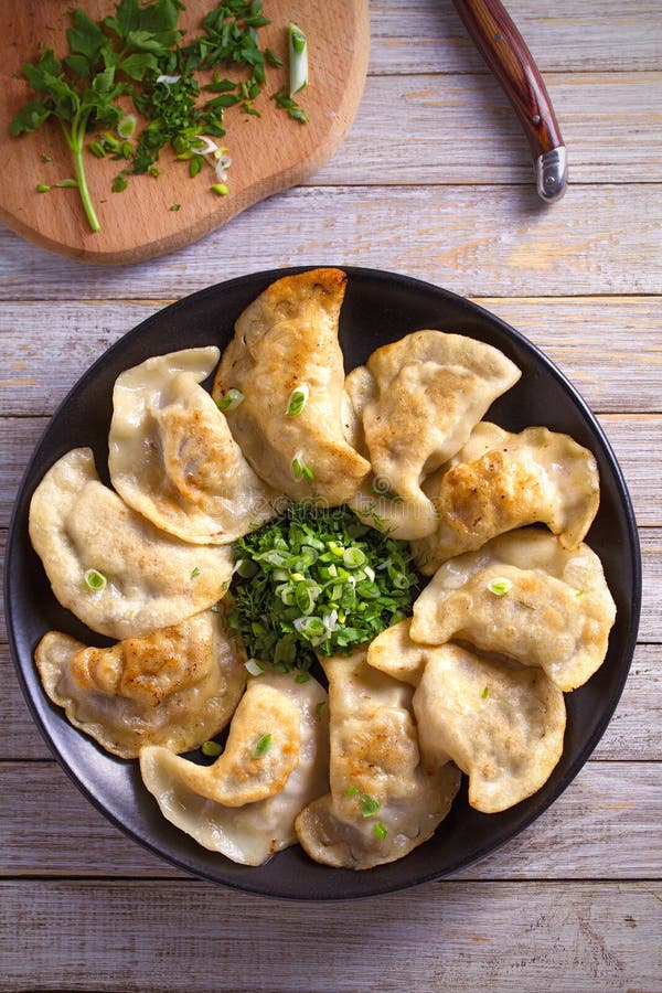Fried Dumplings Stuffed with Meat and Served with Chopped Parsley and ...