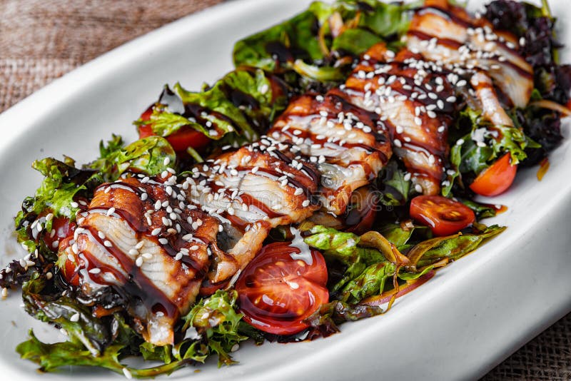 Fried Eel Fish with Sauce and Sesame Stock Image - Image of sauce, fish ...