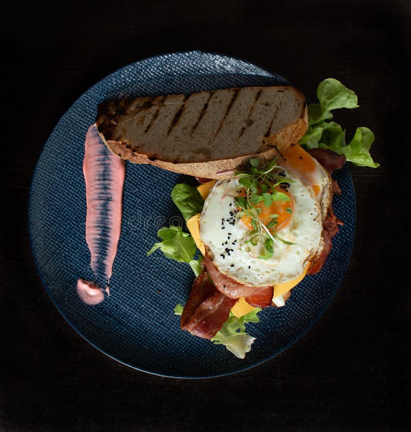 Fried Egg Bacon Cheese Lettuce Bread Roll Breakfast Served on Blue ...