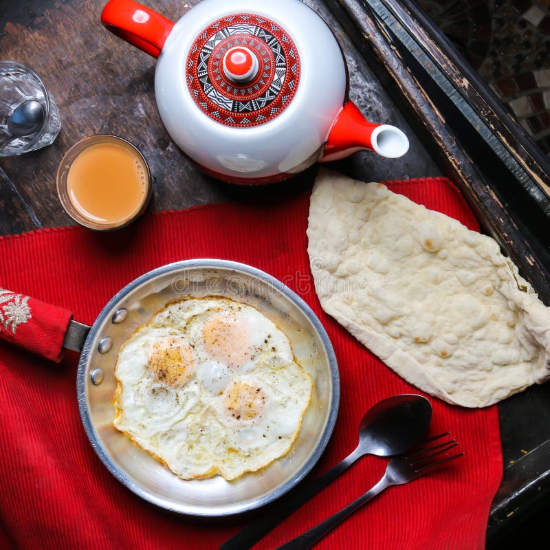 Fried Egg with Bread, Coffee and Teapot Served in Dish Isolated on Red ...