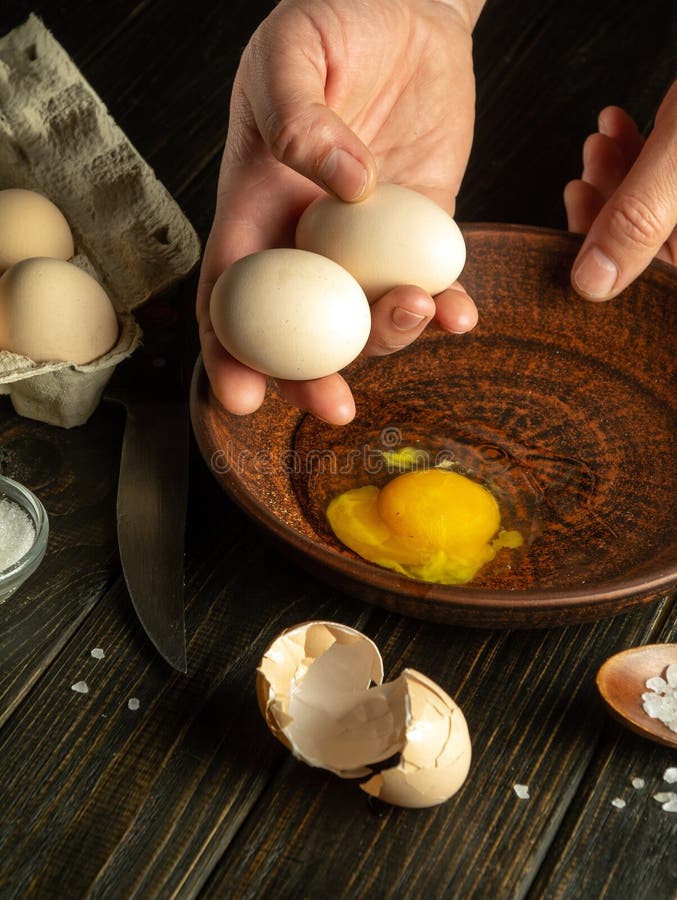 Fried Egg for Breakfast by the Chef Hands in the Restaurant Kitchen ...