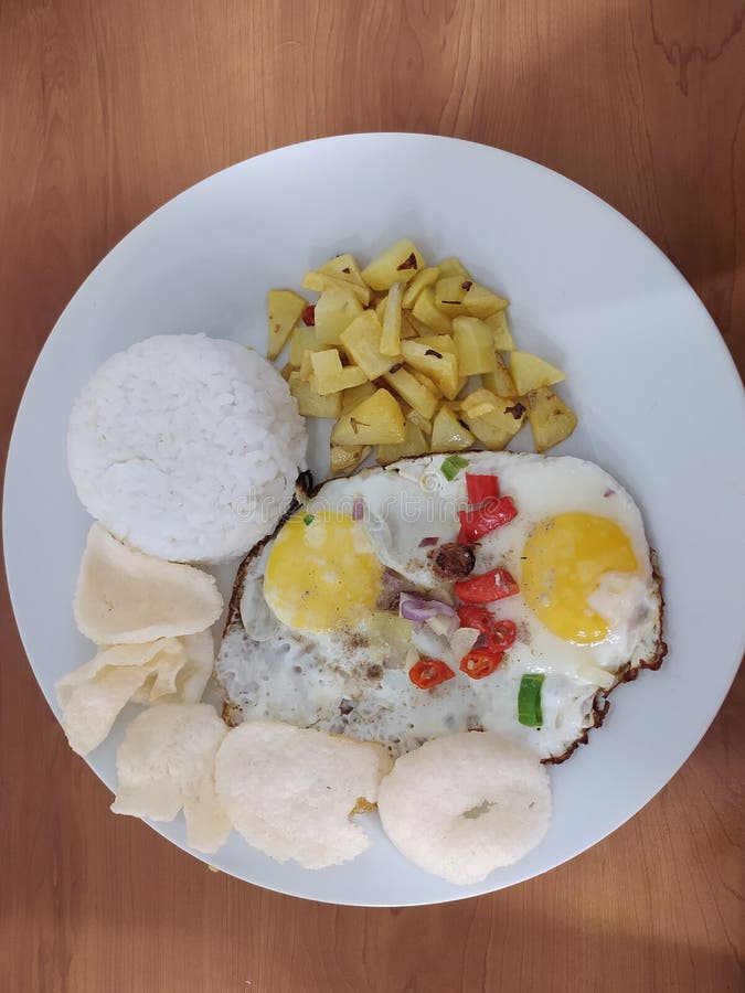 Fried Egg Breakfast Menu with Sliced â€‹â€‹potatoes and White Rice ...