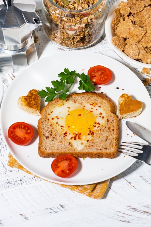 Fried Egg in a Heart Shape in Toast for Breakfast, Vertical Stock Photo ...