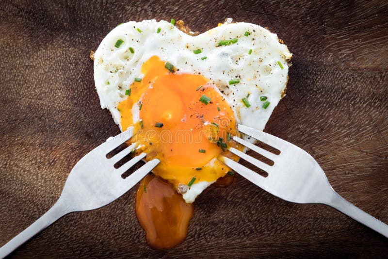 Fried Egg with Heart Shape and Two Dinner Forks, Concept Love Stock ...