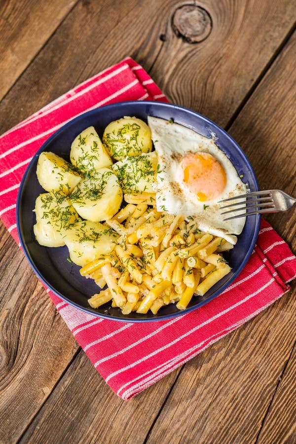 Fried Egg Served with Potatoes and Yellow Beans. Stock Photo - Image of ...