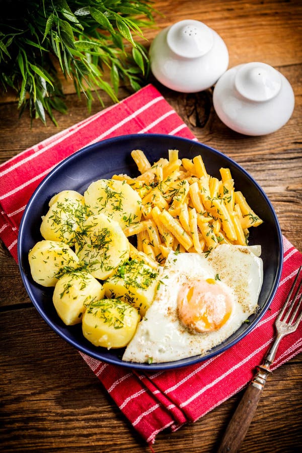 Fried Egg Served with Potatoes and Yellow Beans Stock Image - Image of ...