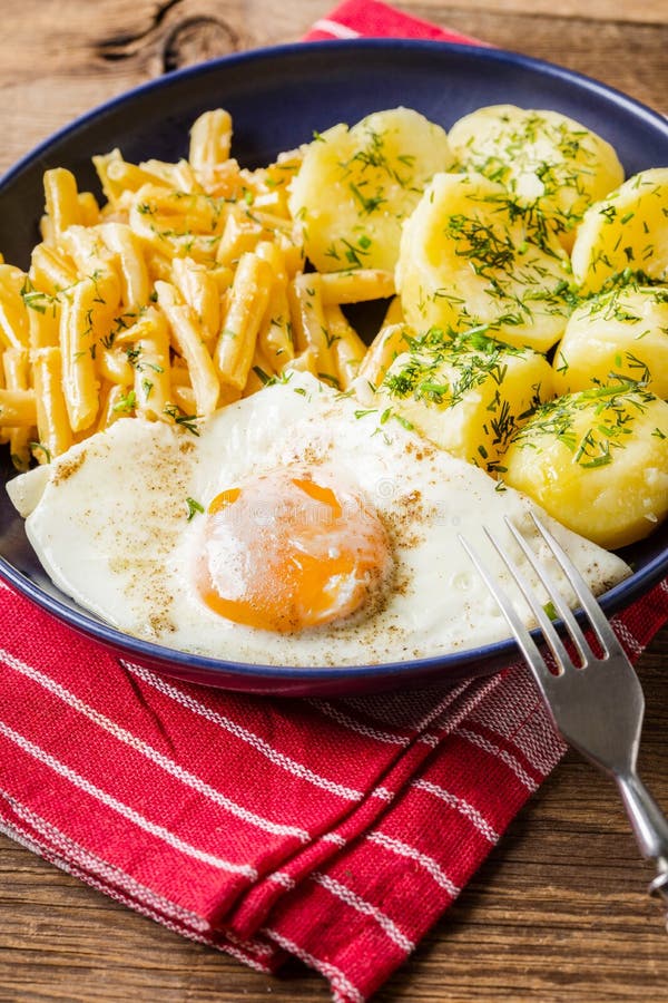 Fried Egg Served with Potatoes and Yellow Beans. Stock Photo - Image of ...