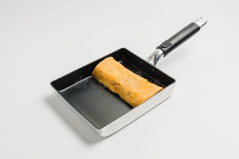 Fried egg in square pan stock photo. Image of look, black - 71785306