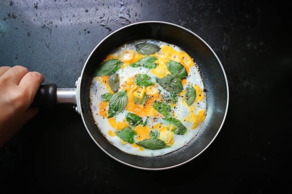 Fried Egg with Sweet Basil and Holy Basil in the Pan Stock Photo ...
