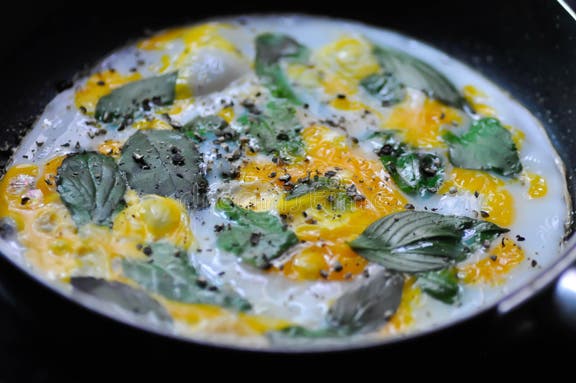Fried Egg with Sweet Basil and Holy Basil in the Pan Stock Image ...