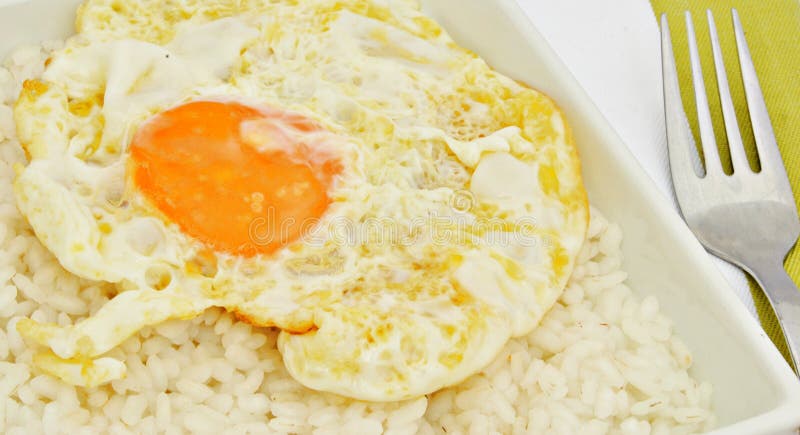 Fried egg on white rice stock photo. Image of clear, rice - 18399298