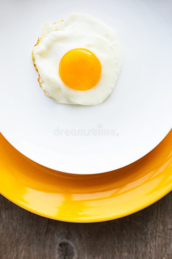 Fried Egg on a White, Yellow Plate. Restaurant. Breakfast Stock Image ...