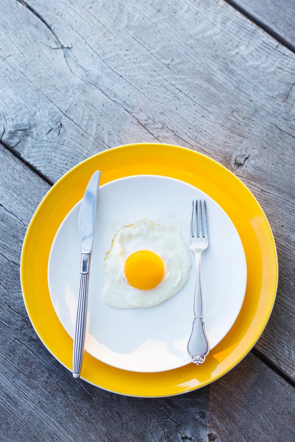 Fried Egg on a White, Yellow Plate. Restaurant. Breakfast Stock Photo ...