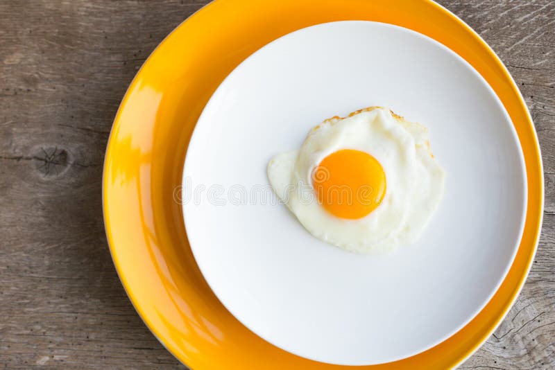 Fried Egg on a White, Yellow Plate. Restaurant. Breakfast Stock Photo ...
