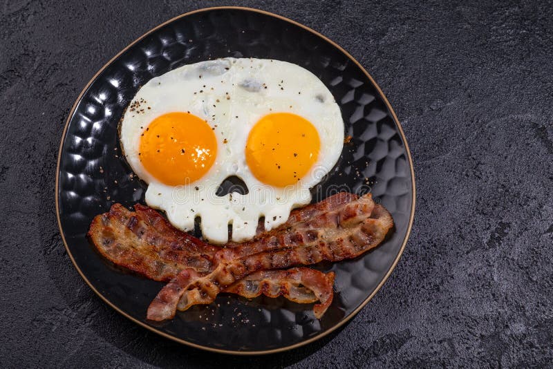Fried Eggs with Bacon in the Shape of a Skull Stock Photo - Image of ...