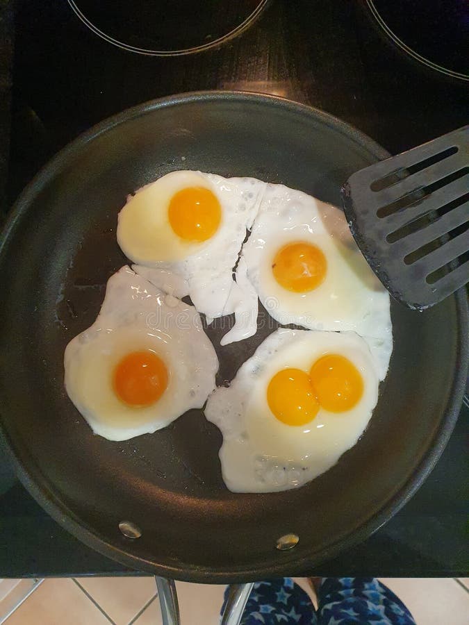 Fried eggs being cooked stock photo. Image of eggs, breakfast - 336315940