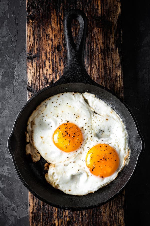 Fried Eggs In An Old Pan With Tomatoes, Avocado Pesto, Green Beans ...