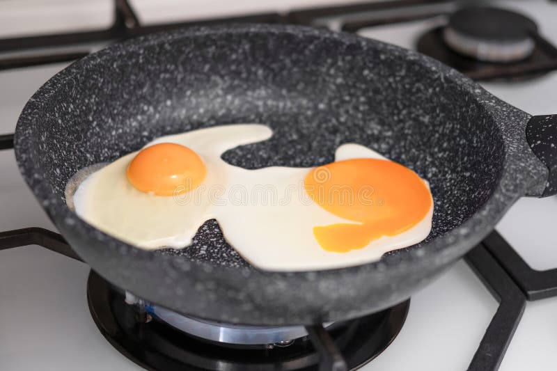 Fried Eggs in a Frying Pan Close-up Stock Image - Image of black, lunch ...