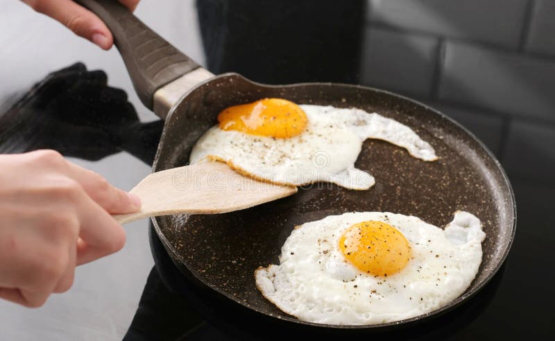 Fried Eggs in a Frying Pan in Close Up View Stock Image - Image of ...