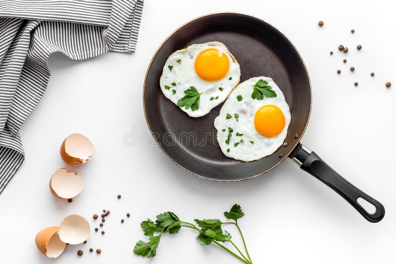 Fried Eggs on Frying Pan on White Desk Top-down Stock Image - Image of ...