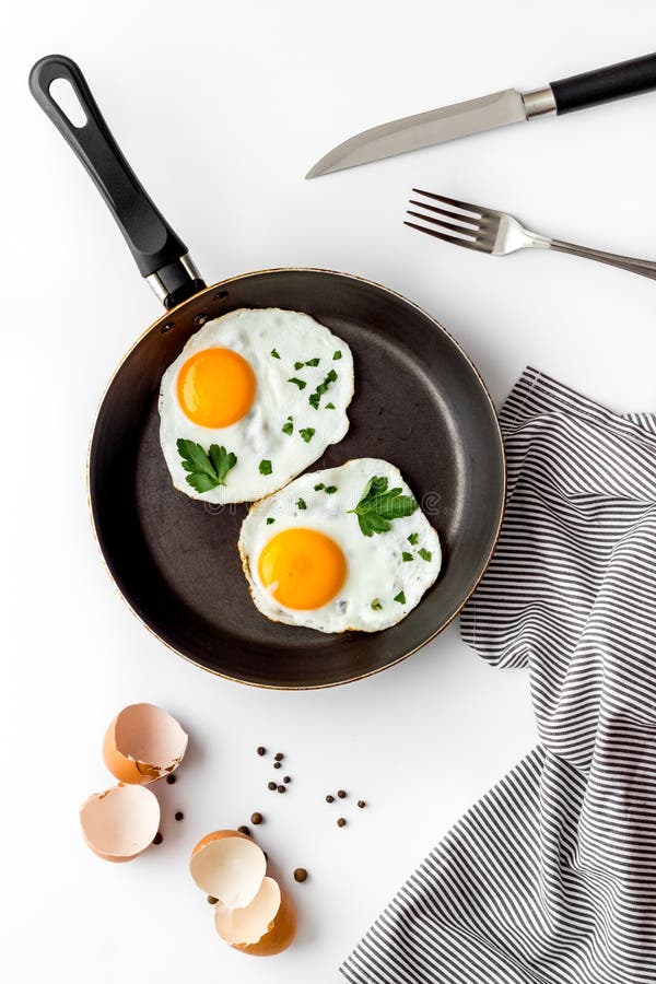 Fried Eggs on Frying Pan on White Desk Top-down Stock Image - Image of ...