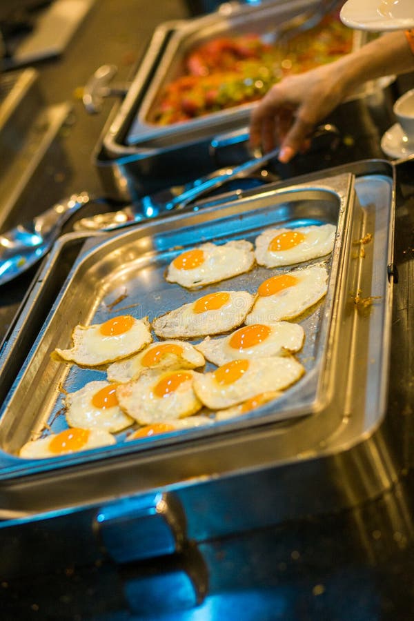 Fried Eggs, a Lot. the Process of Preparing Breakfast in the Buffet ...