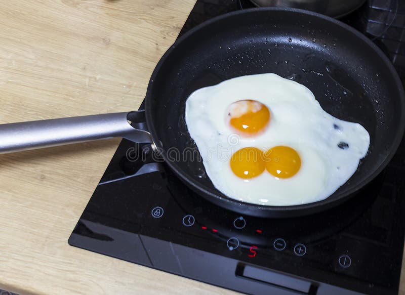 Fried Eggs on the Pan One of Them with Double Egg Egg Yolk. Food Stock ...