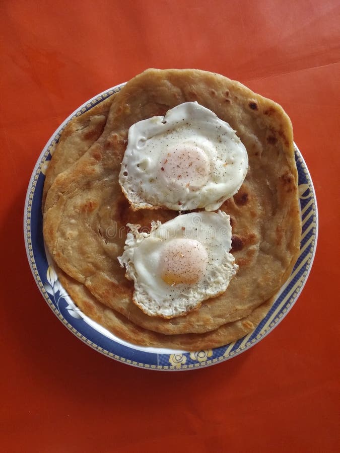 Fried eggs with paratha stock image. Image of food, paratha - 63861377