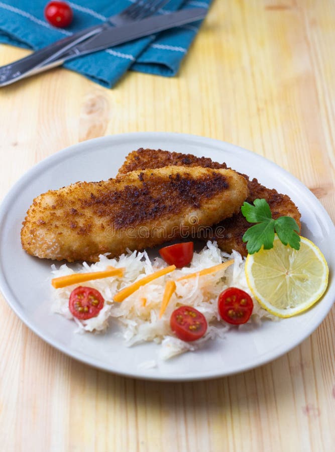 Fried Fish in Batter with Lemon and Cabbage, Carrot and Tomato Salad ...
