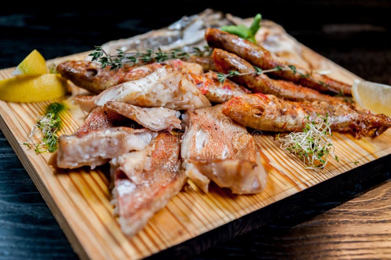 Fried Fish on a Big Wooden Board. Stock Image - Image of drink ...