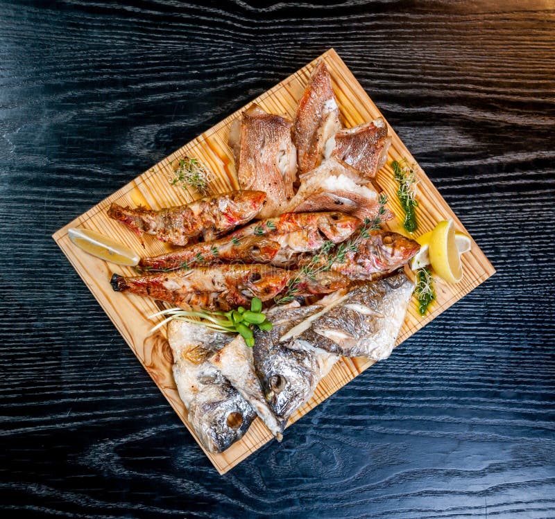 Fried Fish on a Big Wooden Board. Stock Image - Image of lunch, board ...