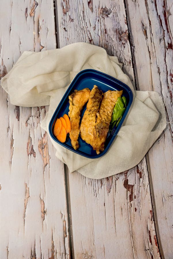 Fried fish in a blue plate stock image. Image of fried - 135603907