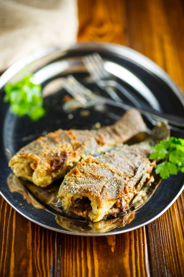Fried fish in breading stock photo. Image of delicious - 99350448