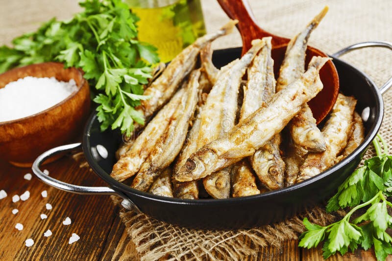 Fried fish capelin stock photo. Image of olive, fish - 64960440