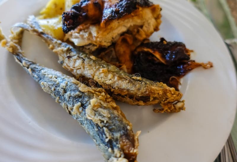 Fried Fish and Chicken on a Plate in a Resort on Vacation Stock Photo ...