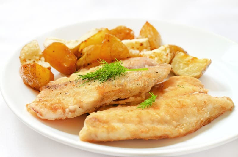 Fried Fish Fillet with Baked Potatoes Stock Image - Image of meal ...