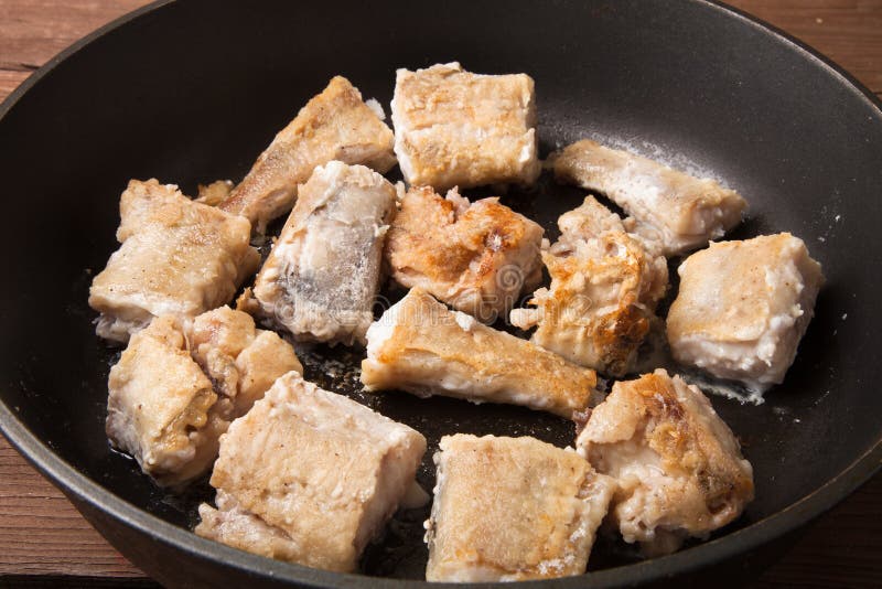 Fried Fish Fillet on a Frying Pan Stock Photo - Image of oily, herring ...